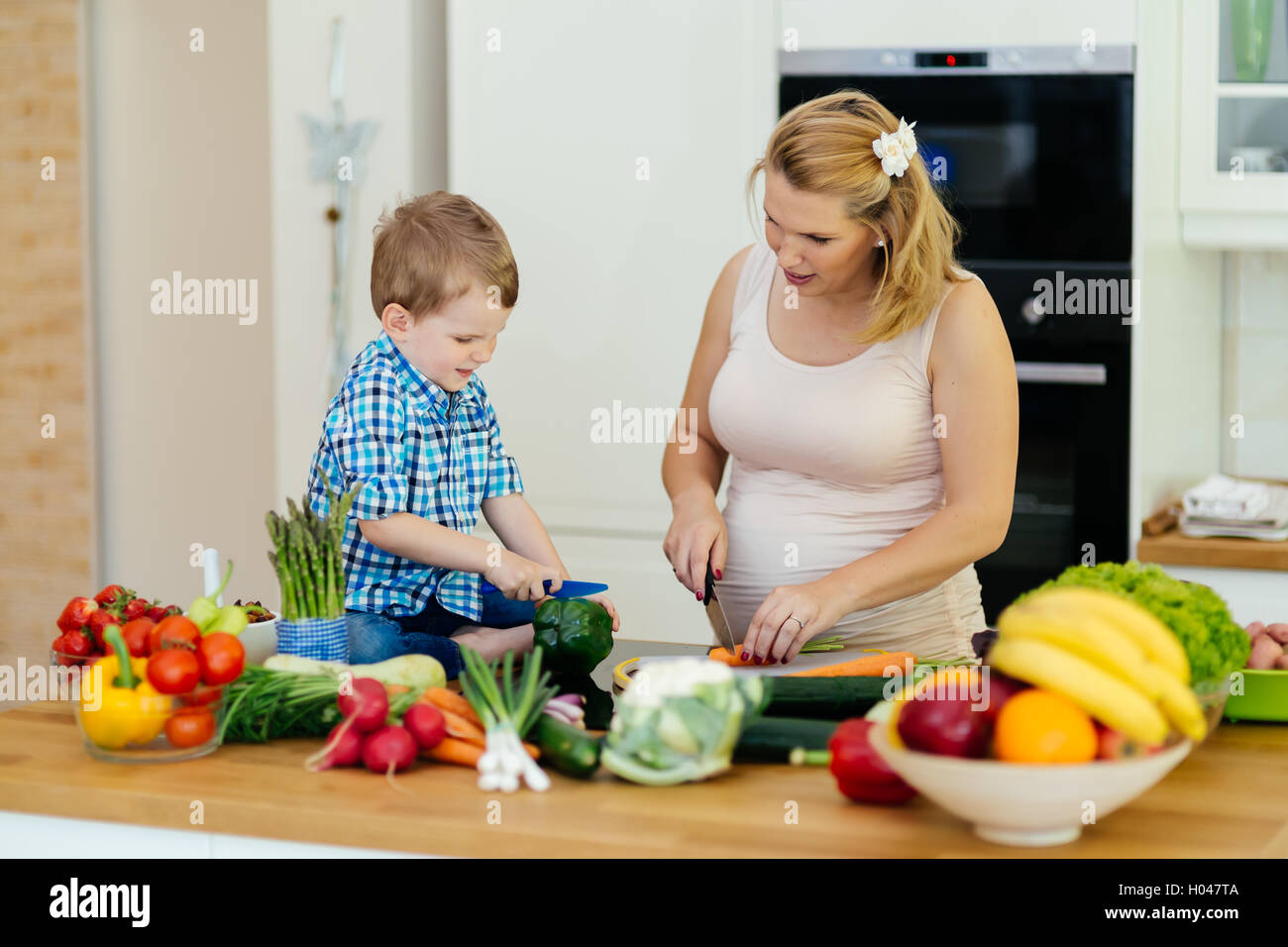 Mother and child preparing lunch from fresh veggies Stock Photo - Alamy