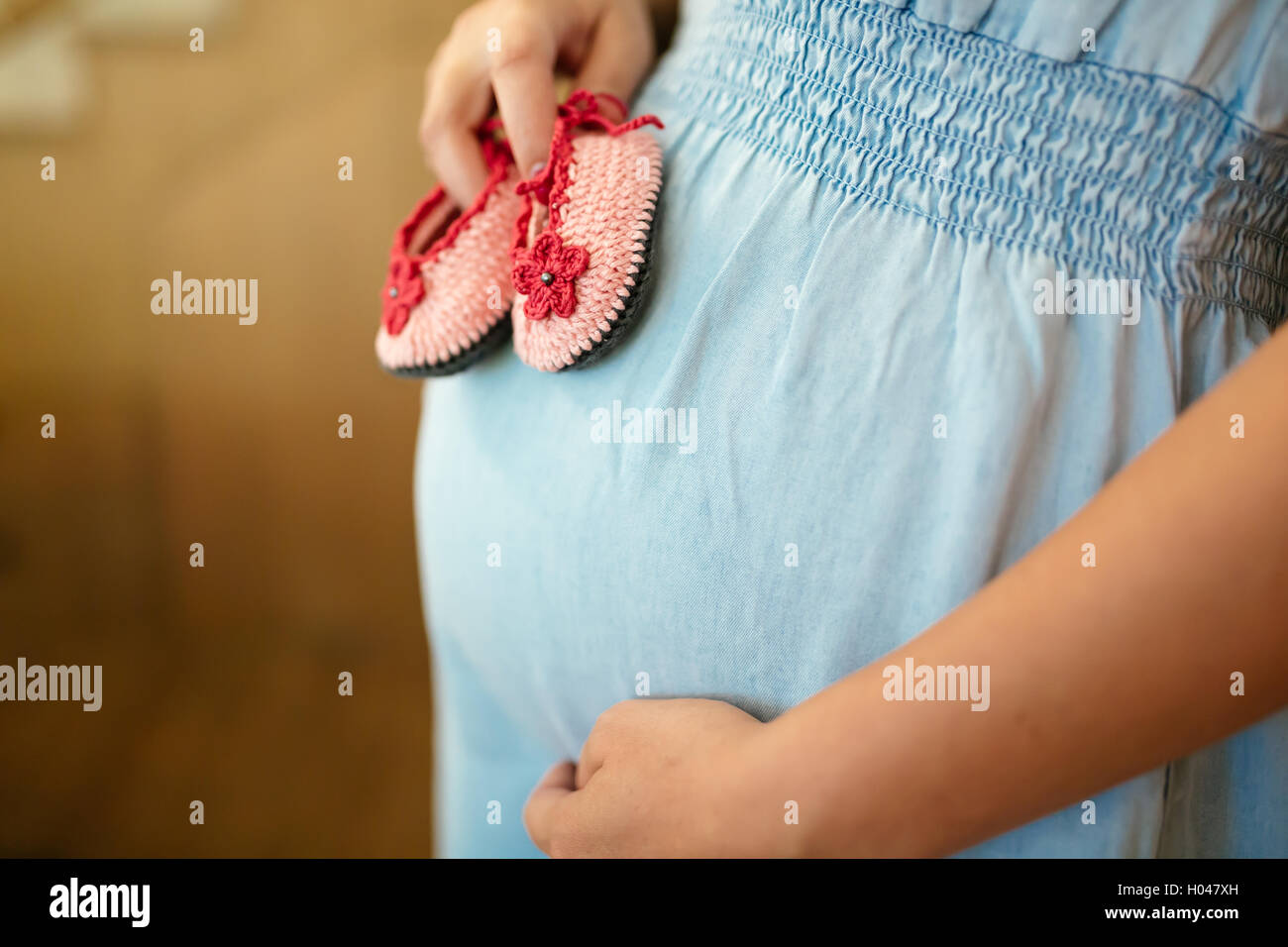 Beautiful girl hands stomach hi-res stock photography and images - Alamy
