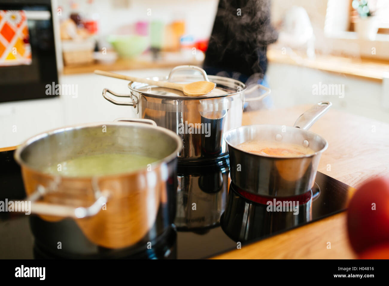 Housewife making lunch in modern kitchen Stock Photo - Alamy
