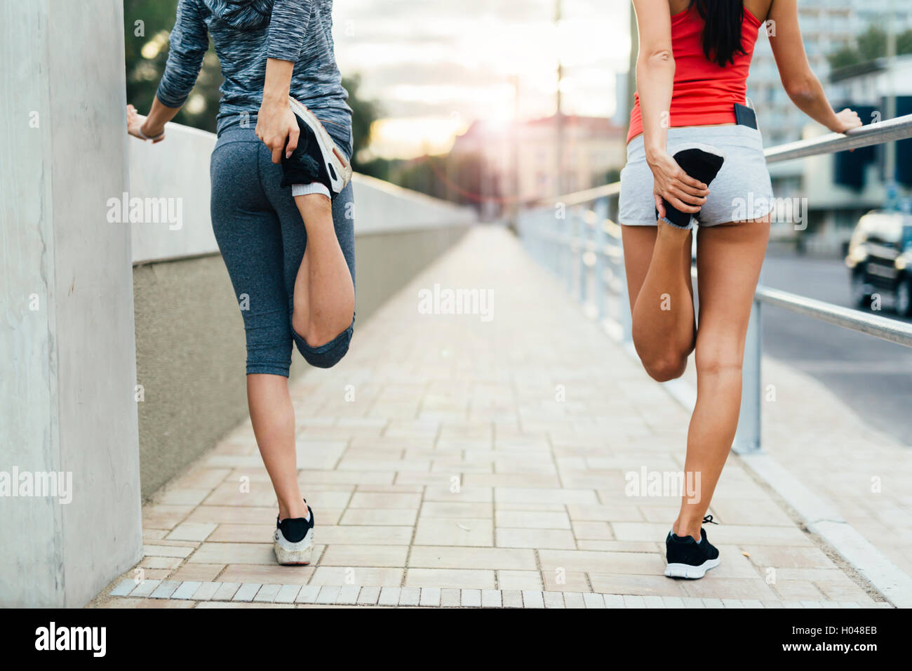 Women stretching outdoor before running Stock Photo - Alamy
