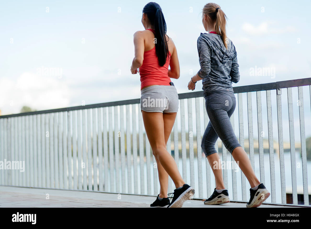 Fit women jogging outdoors and living a healthy lifestyle Stock Photo ...