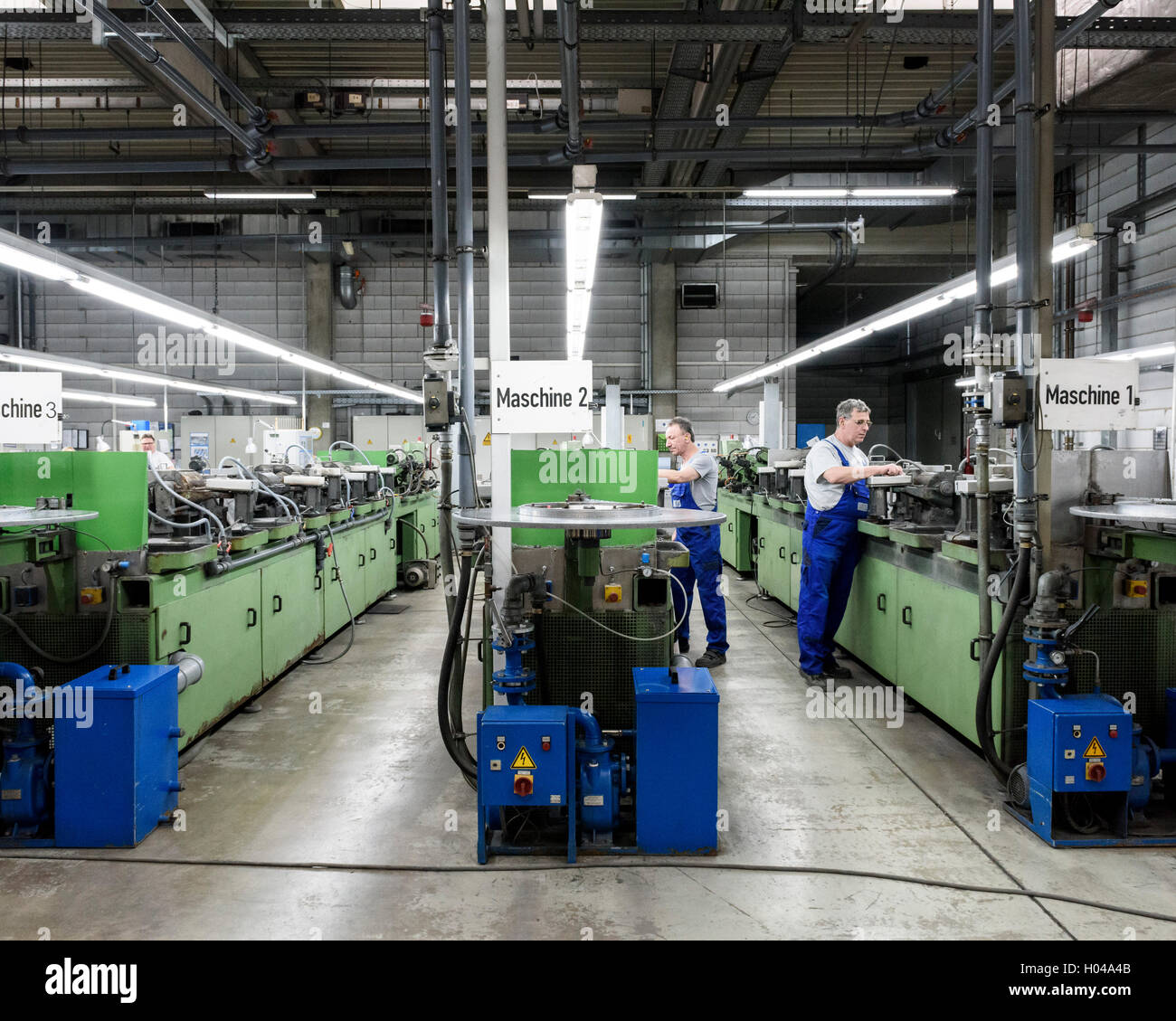 Workers check the sharpening process. Harry's Razor Blade Factory ...