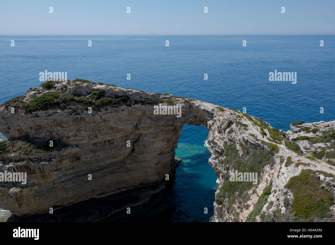 The Trypitos Arch, a limestone arch over the sea on Paxos, The Ionian ...