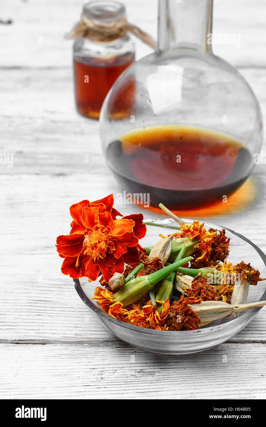 Medical extract decoction from the flowers of marigold Stock Photo - Alamy