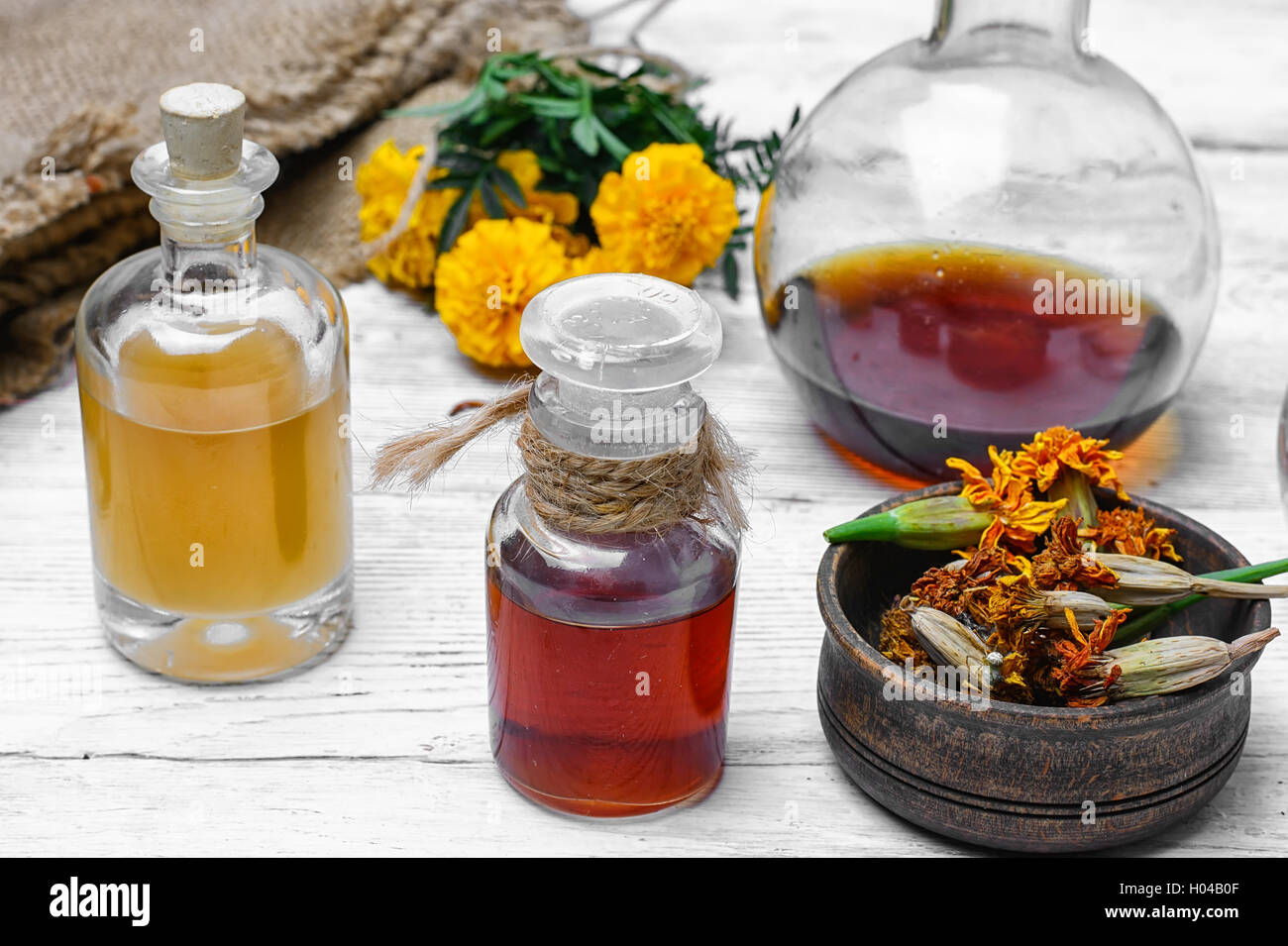 Medical extract decoction from the flowers of marigold Stock Photo - Alamy
