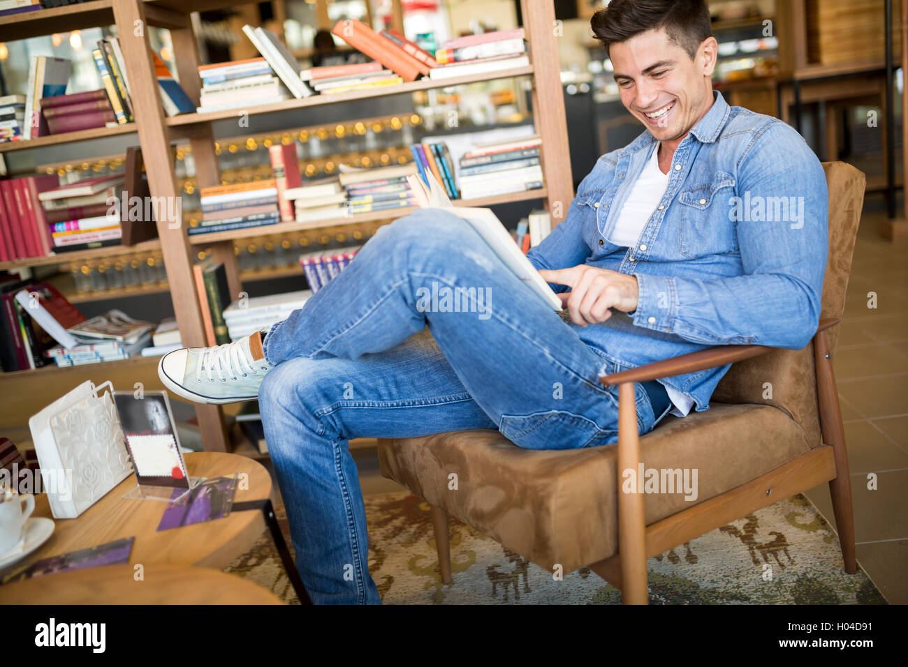Handsome man studying by reading books and preparing for exam Stock ...