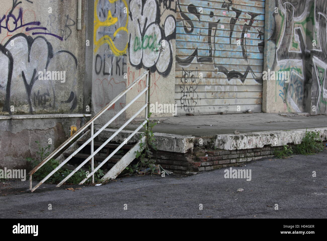 a beautifully decayed urban street alleyway with graffiti, photoarkive ...