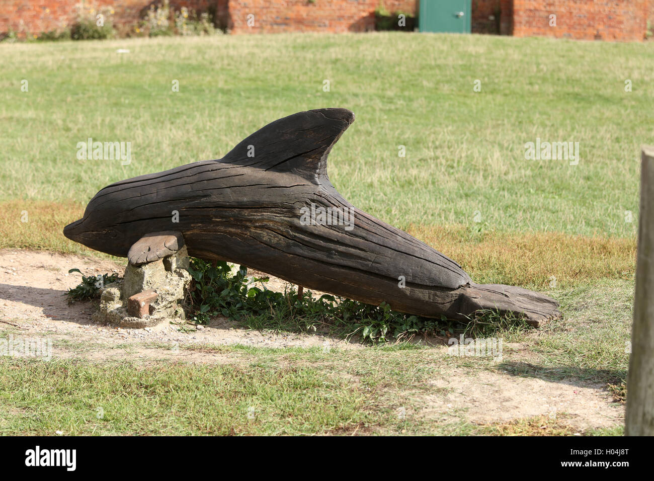 Wooden dolphin on the Isle of Wight Stock Photo - Alamy