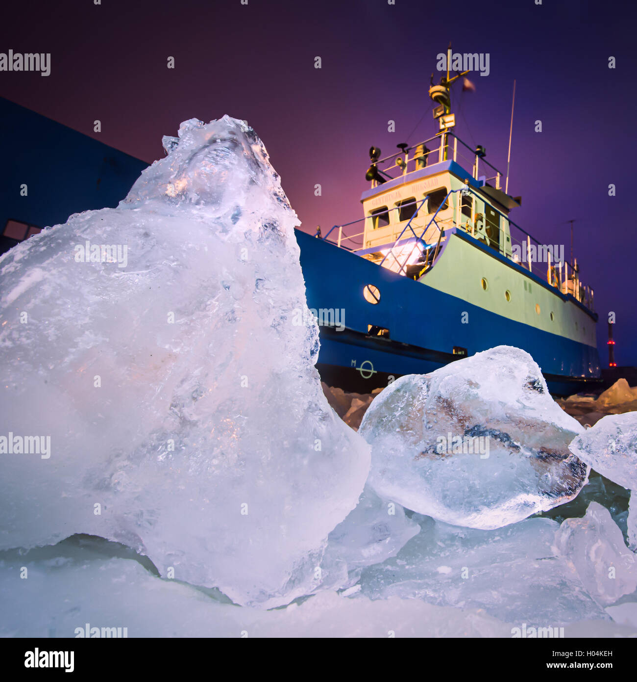 The Icebreaker ship trapped in ice tries to break and leave the bay ...