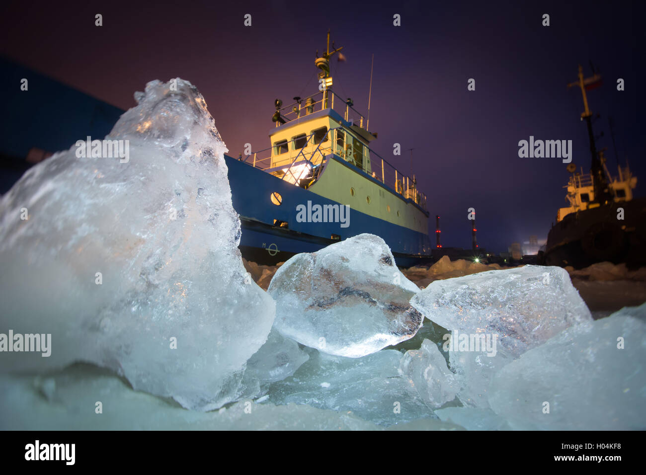 The Icebreaker ship trapped in ice tries to break and leave the bay ...