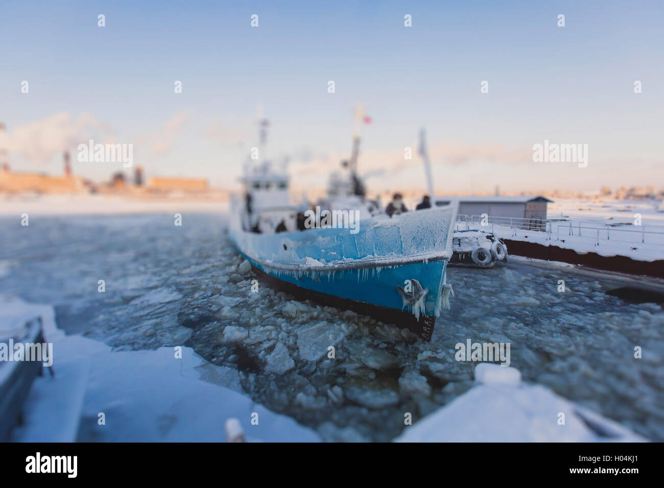 The Icebreaker ship trapped in ice tries to break and leave the bay ...