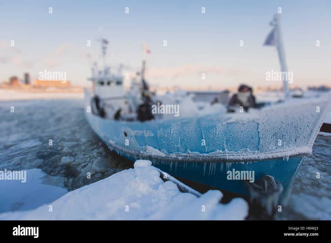 The Icebreaker ship trapped in ice tries to break and leave the bay ...