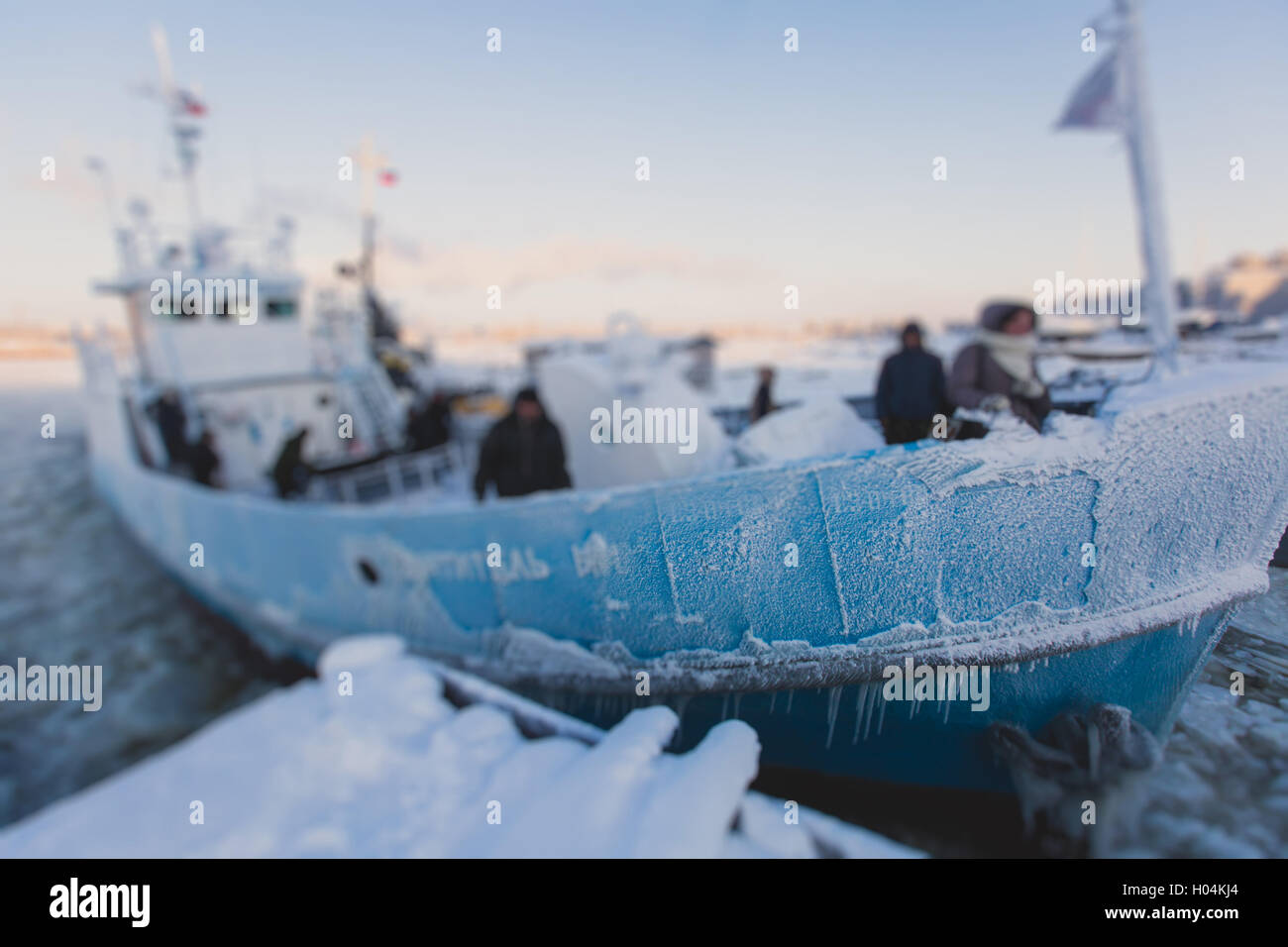 The Icebreaker ship trapped in ice tries to break and leave the bay ...