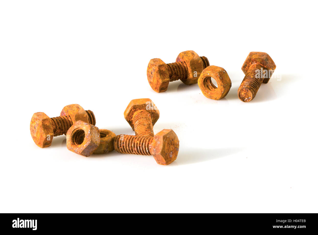 rusty bolts and nuts on white background Stock Photo - Alamy