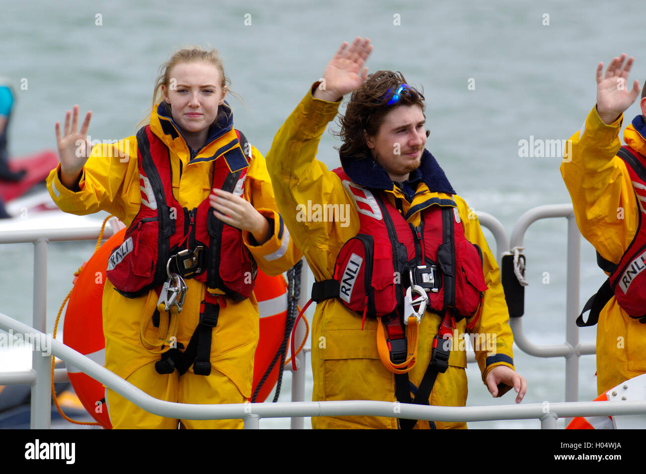 Lifeboat with crew waving hi-res stock photography and images - Alamy