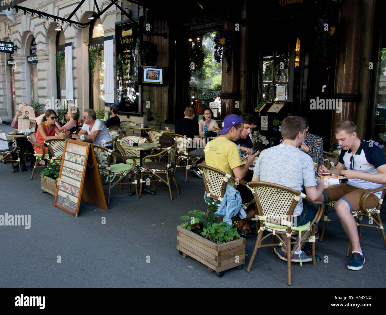 People eating out at a street cafe and restaurant.Budapest.Hungary ...