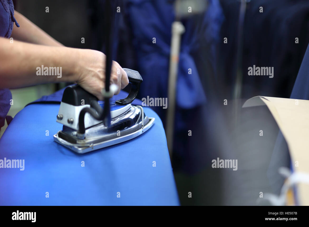 The steam generator. Clothing industry. Ironing steam. Presser in ...