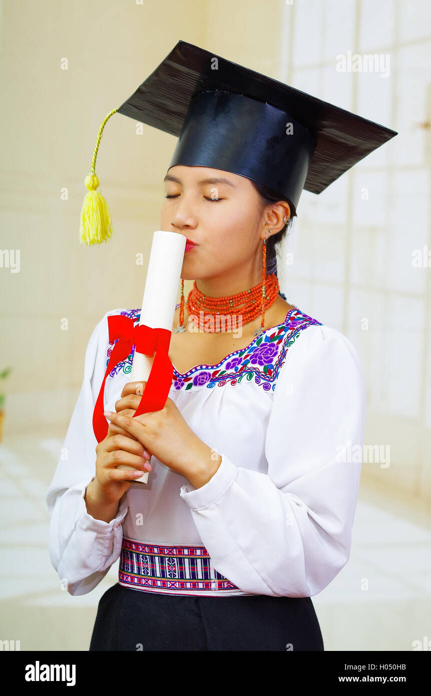 Young female student wearing traditional blouse and graduation hat ...