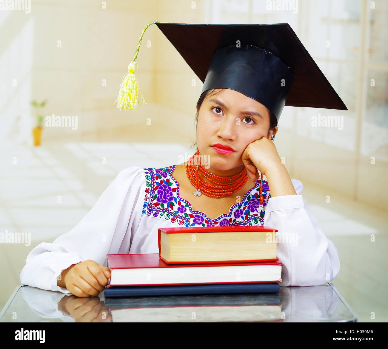 Young female student wearing traditional blouse and graduation hat ...