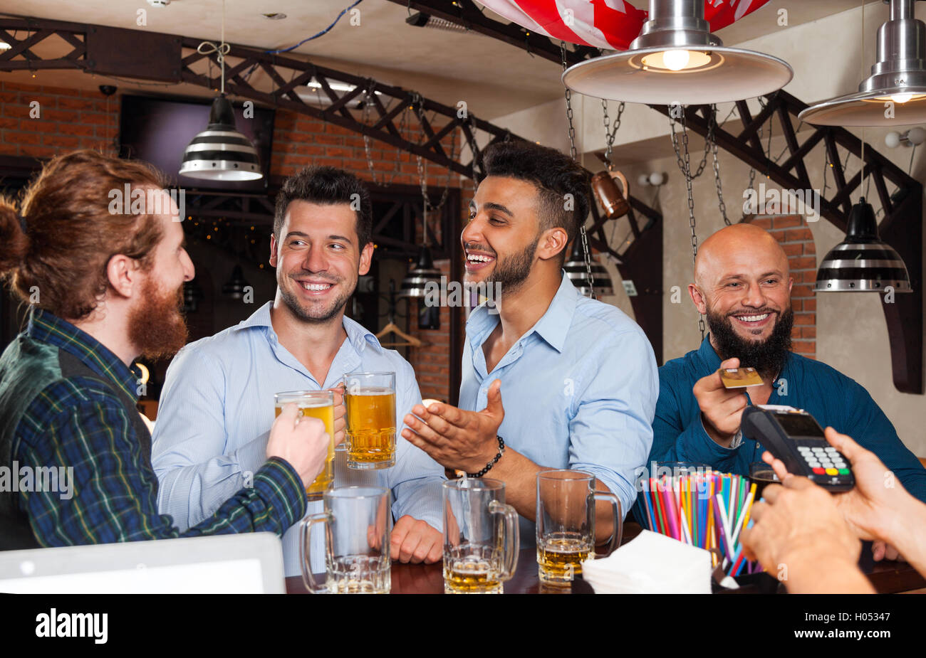 Man Group In Bar Drinking Beer, Mix Race Friends Meeting, Bearded Man ...