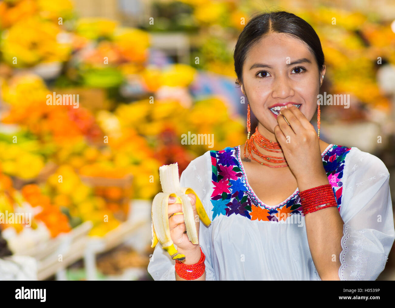 Beautiful young hispanic woman wearing andean traditional blouse posing ...
