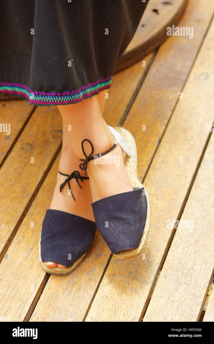 Closeup womans feet wearing simple traditional andean shoes, lace with ...