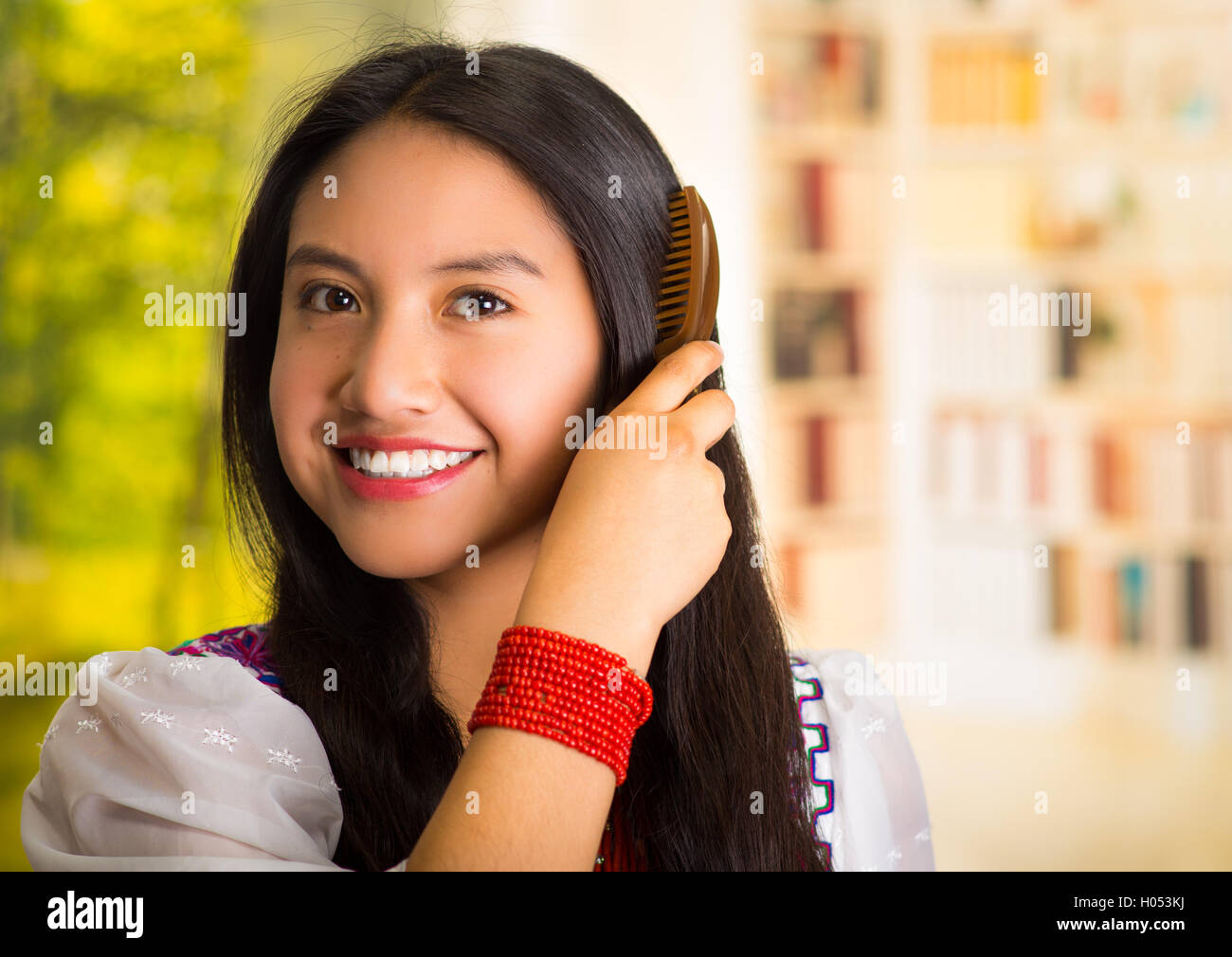 Beautiful hispanic woman wearing white blouse with colorful embroidery ...