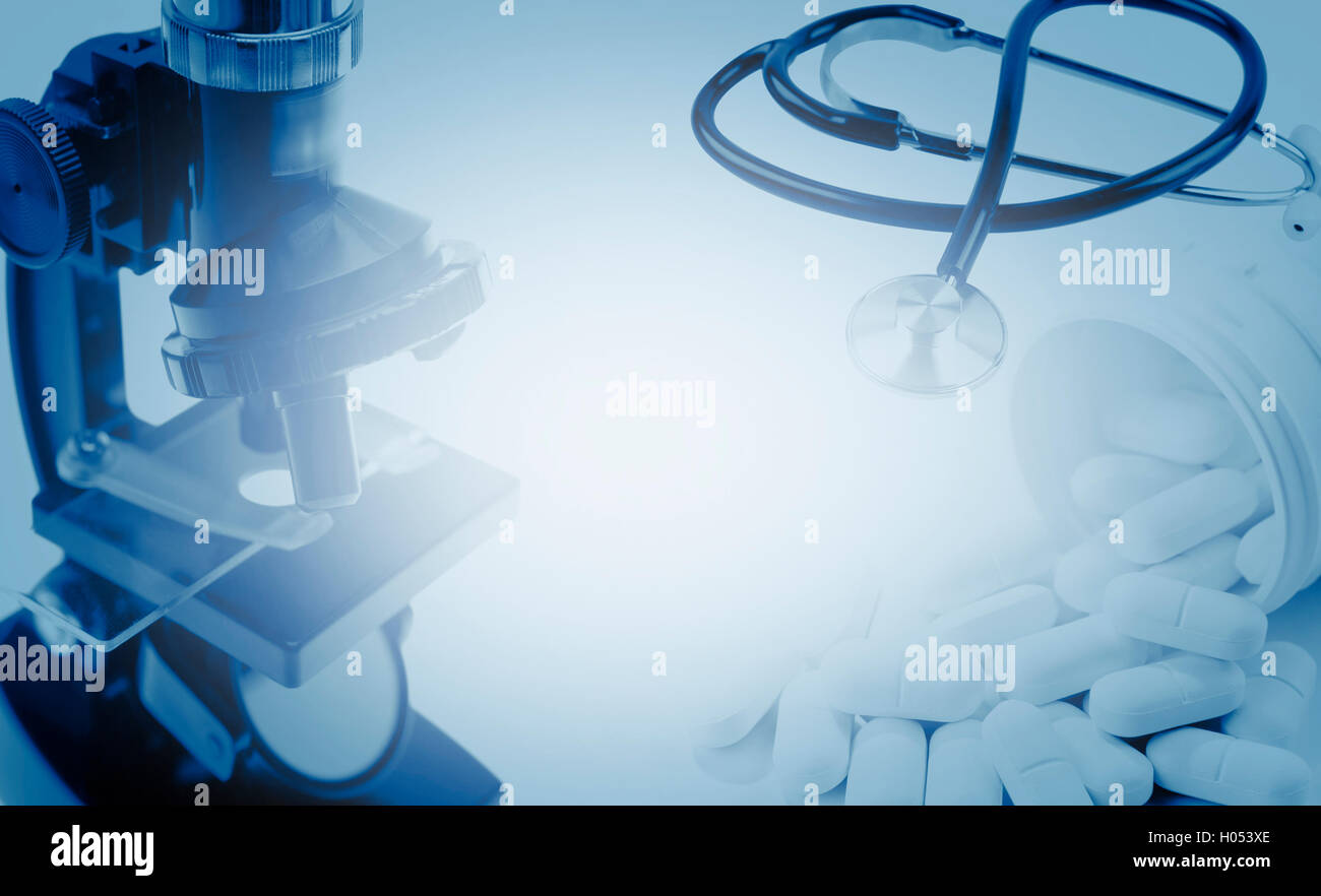 Microscope, stethoscope and pills. Copy space Stock Photo - Alamy