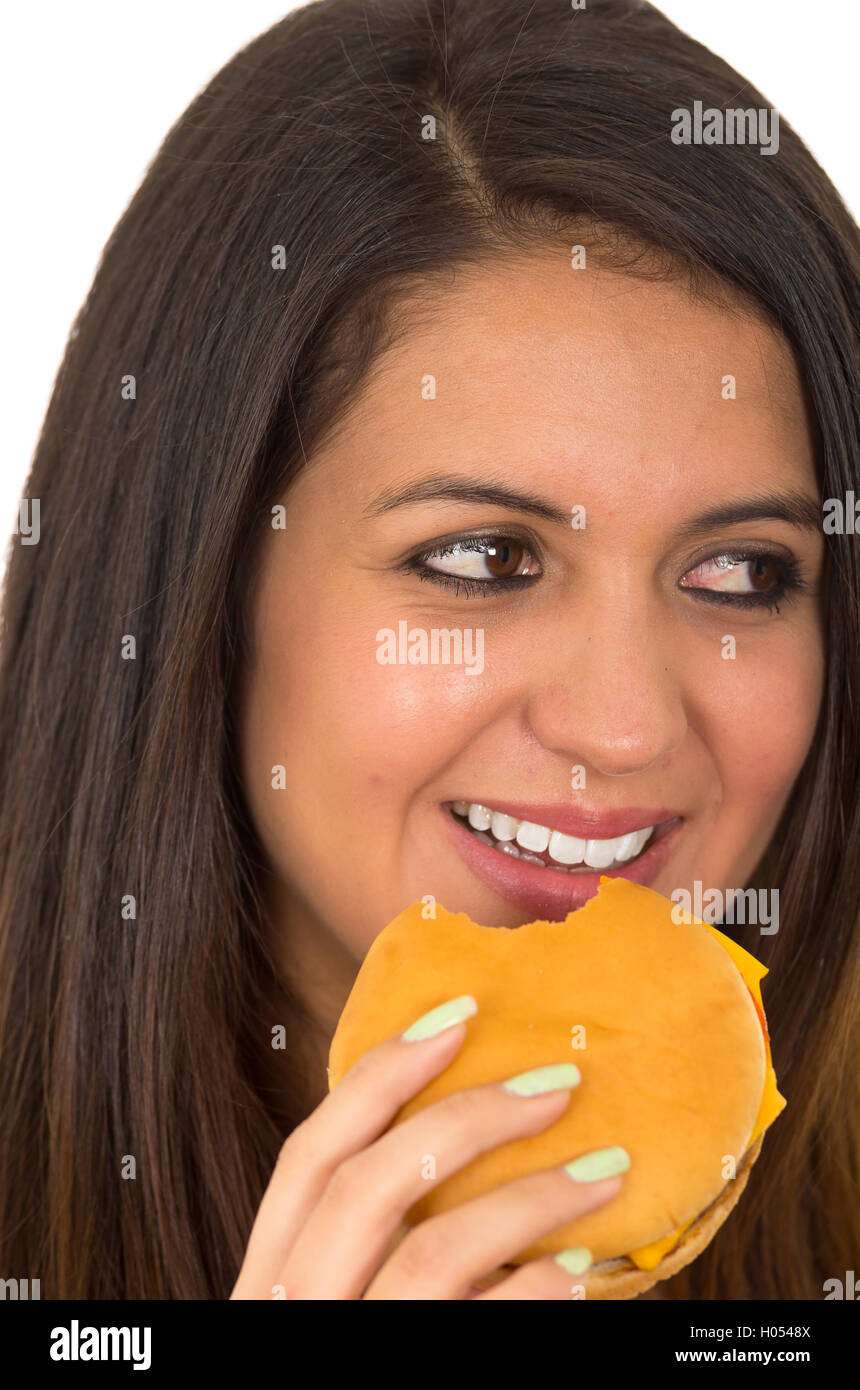 Closeup headshot beautiful young woman posing for camera eating ...
