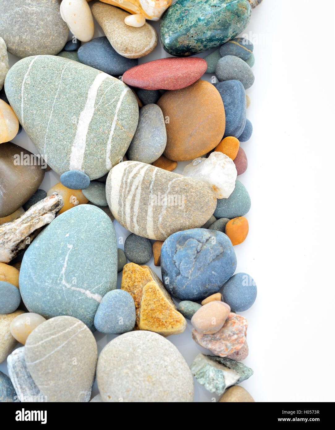 colored stones on white background Stock Photo - Alamy