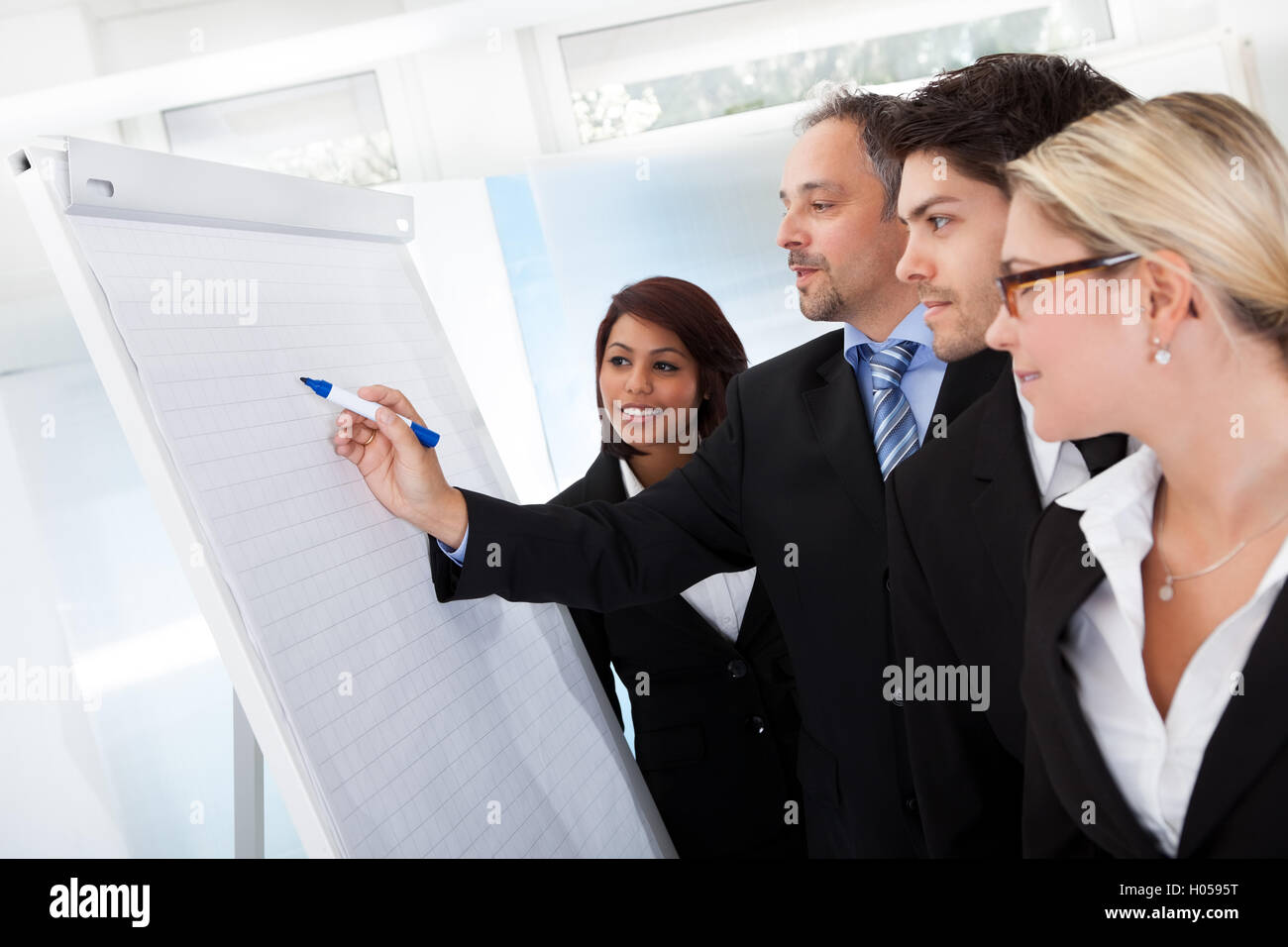 Group of business people at presentation Stock Photo - Alamy