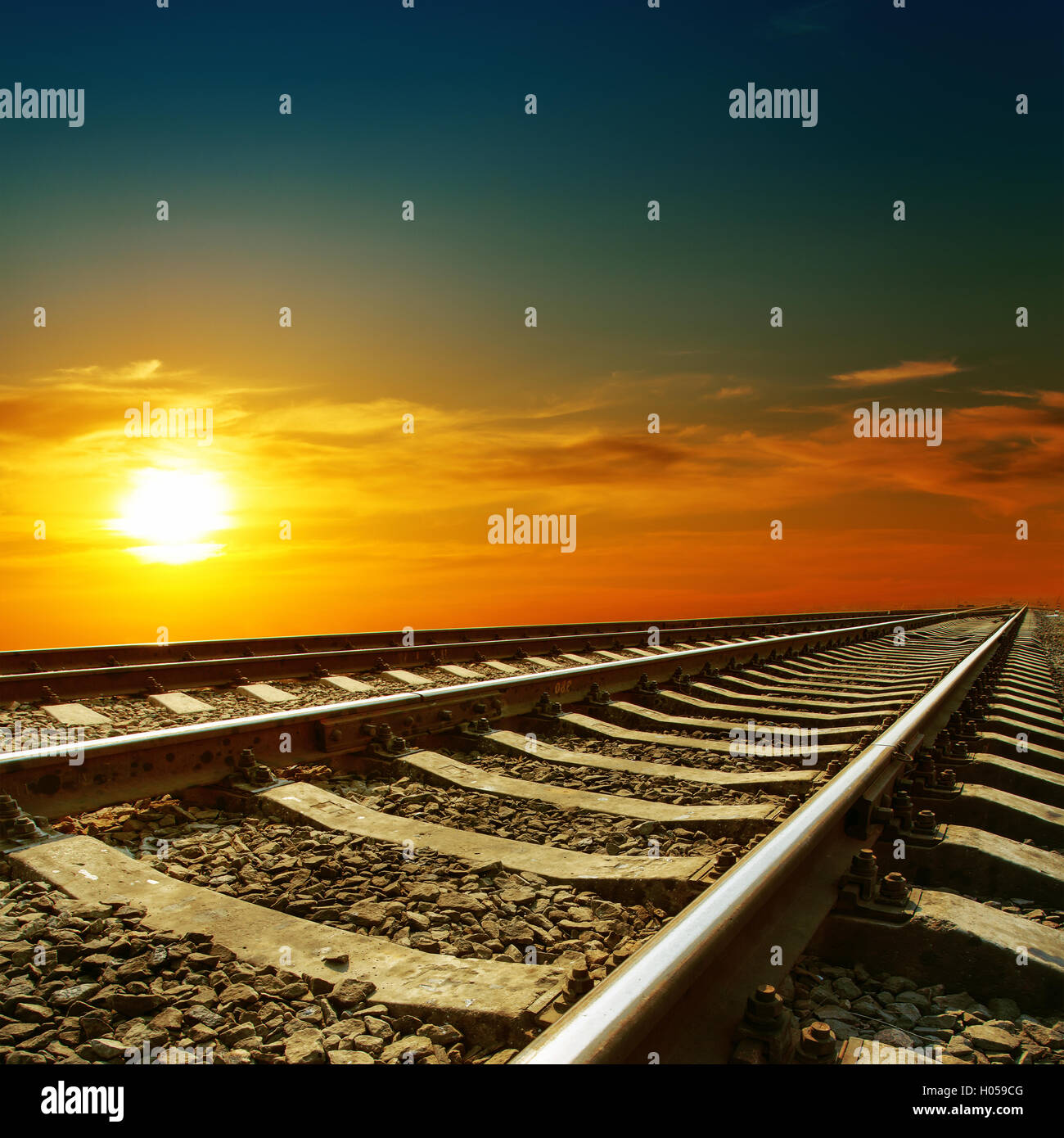 orange sunset over railroad Stock Photo - Alamy