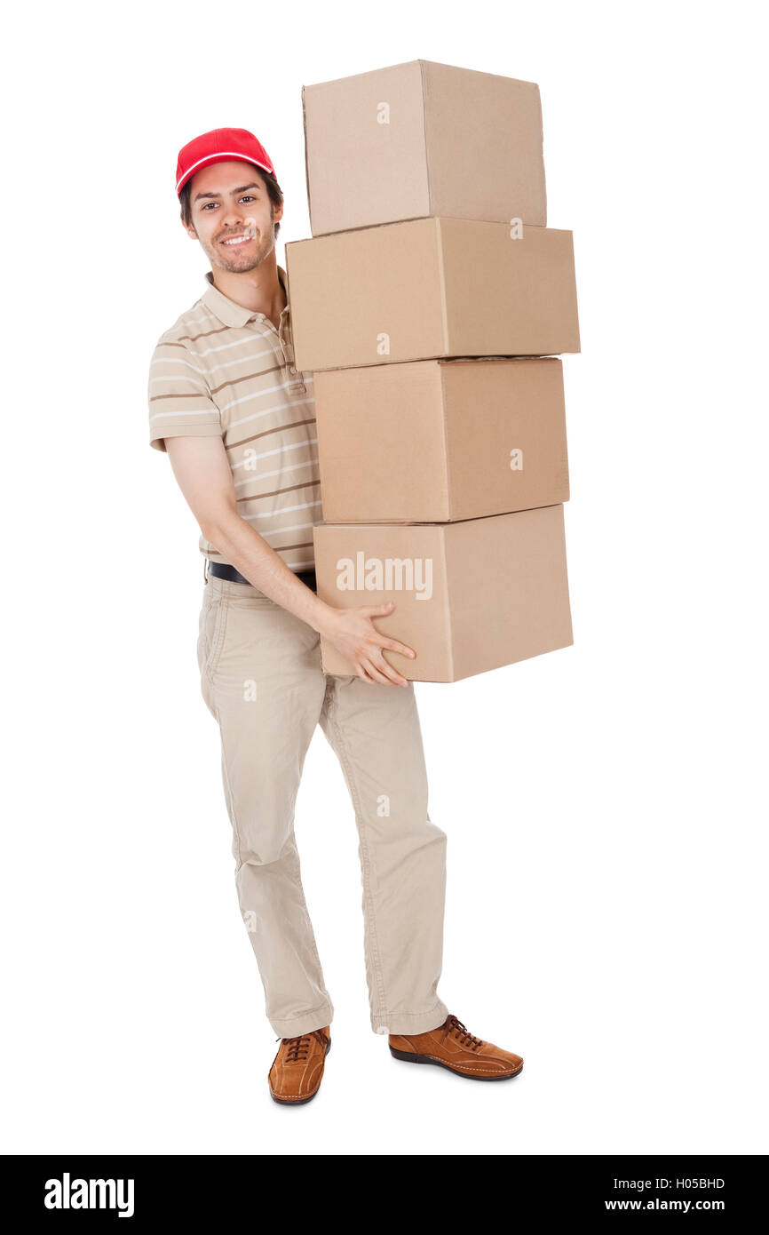 Delivery man carrying stack of boxes Stock Photo - Alamy