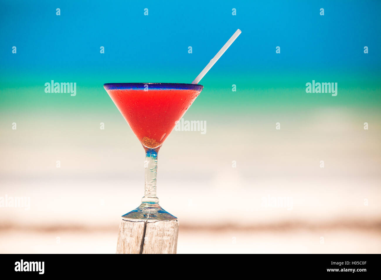 Strawberry margarita on the sandy white beach Stock Photo - Alamy