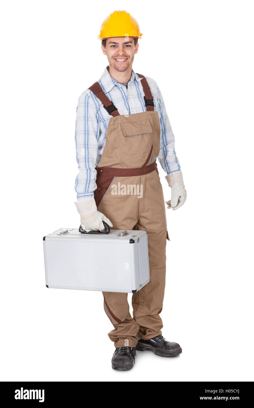 Workman carrying a toolkit Stock Photo - Alamy