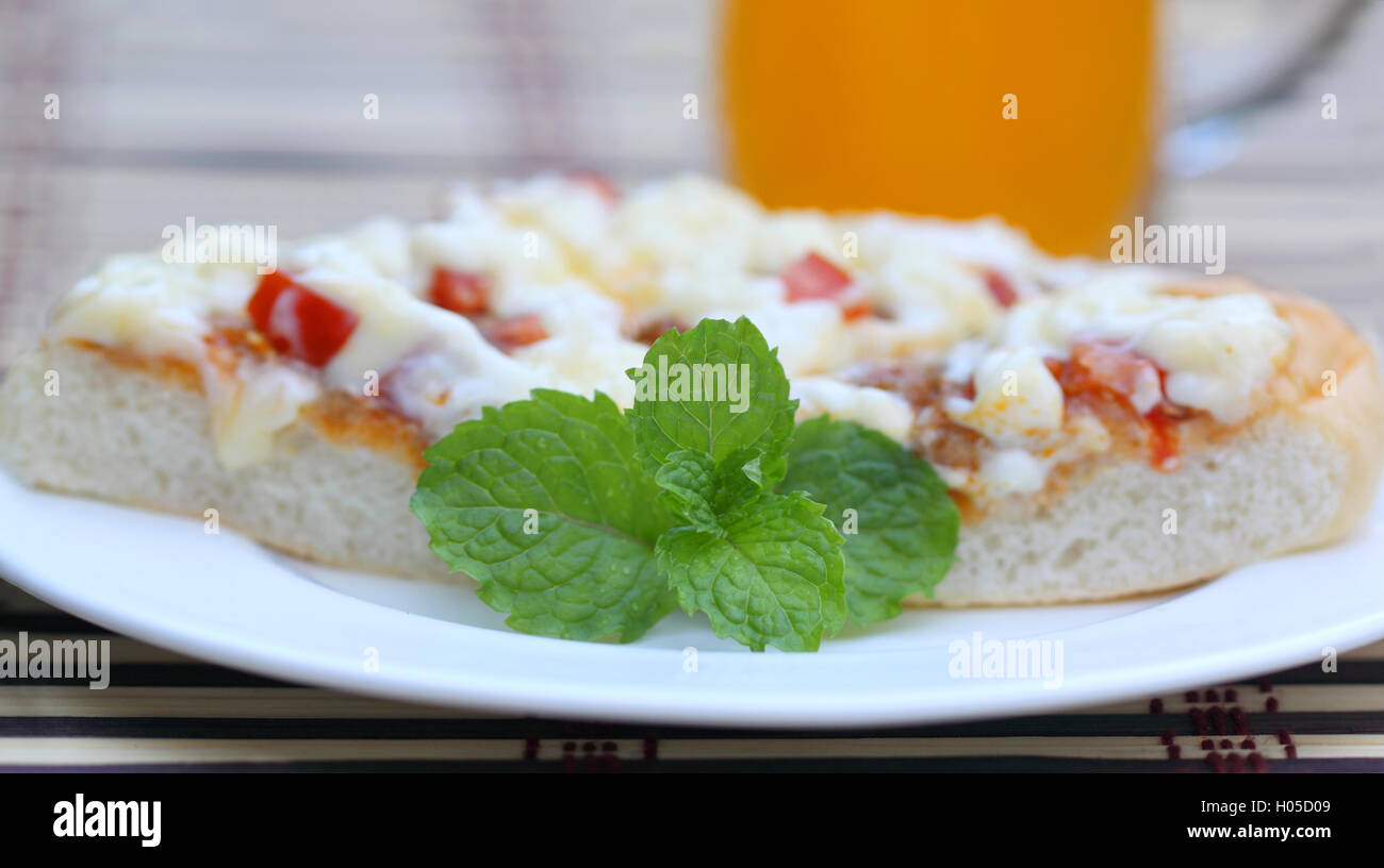 Pizza with mint leaves Stock Photo - Alamy