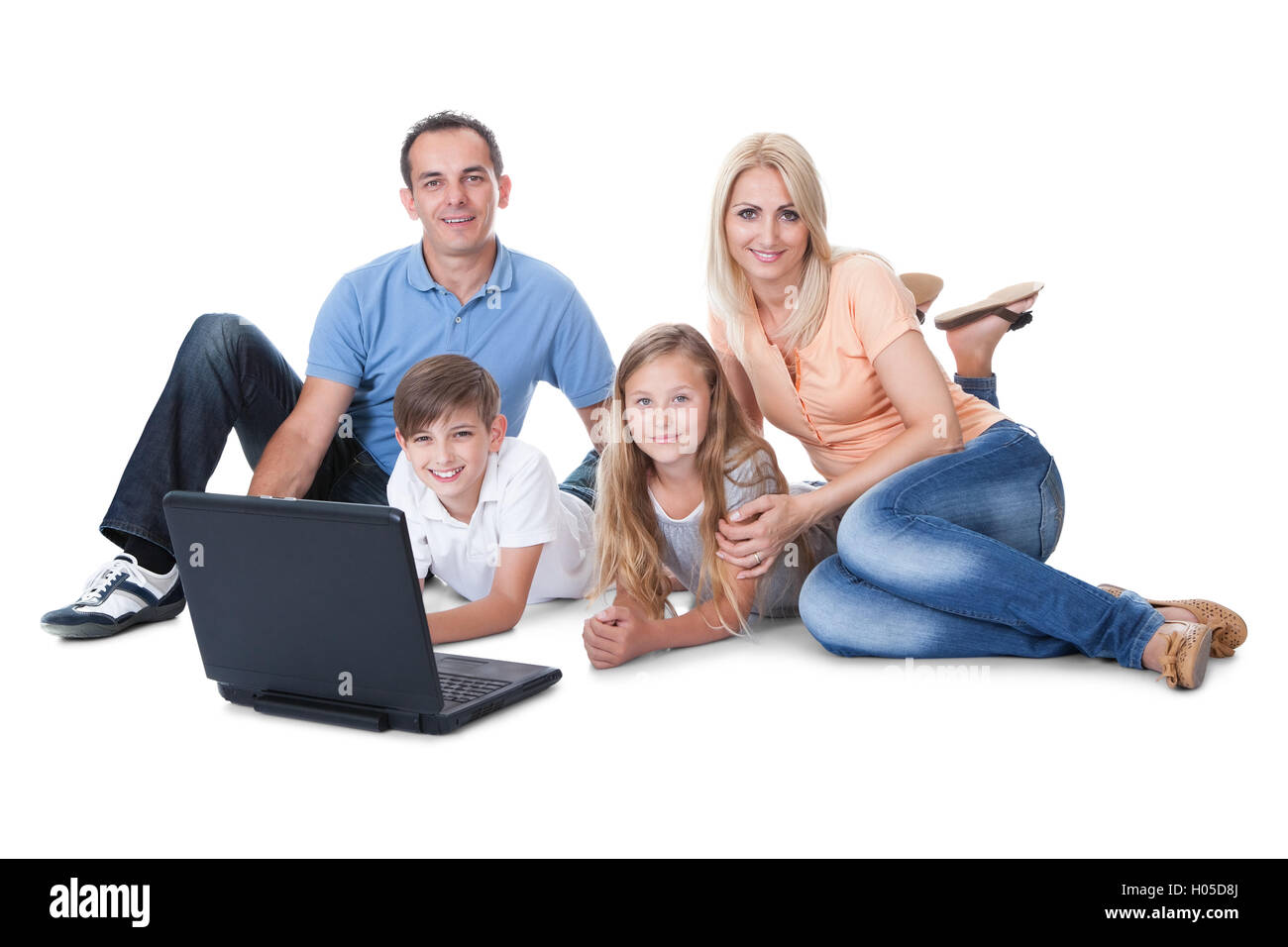 Happy Family With Two Children Using Laptop Stock Photo - Alamy