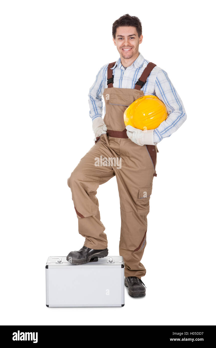 Workman carrying a toolkit Stock Photo - Alamy
