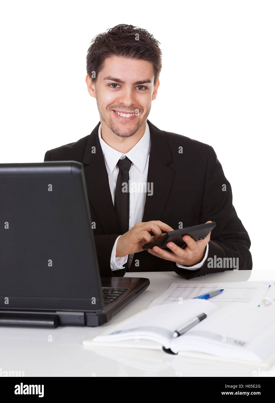 Young accountant making calculations Stock Photo - Alamy