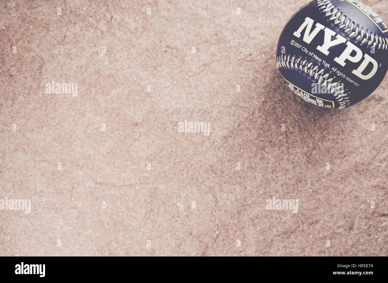 NYPD blue baseball ball on a stone background - copy space Stock Photo ...