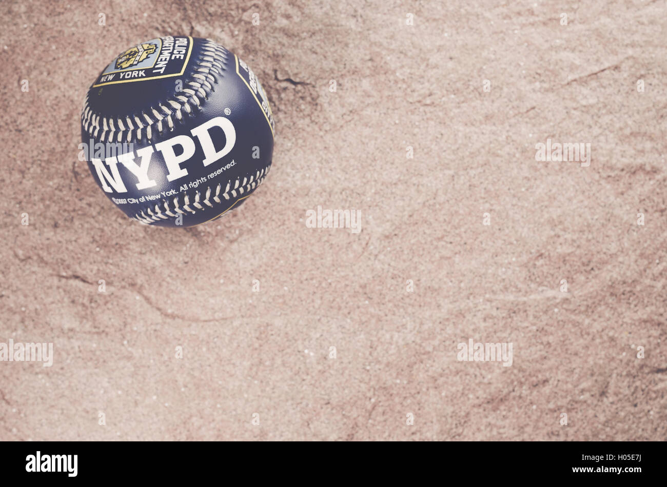 NYPD blue baseball ball on a stone background - copy space Stock Photo ...