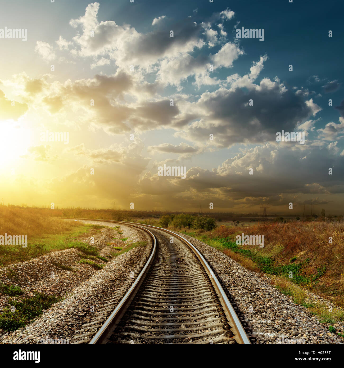 sunset over railroad Stock Photo - Alamy