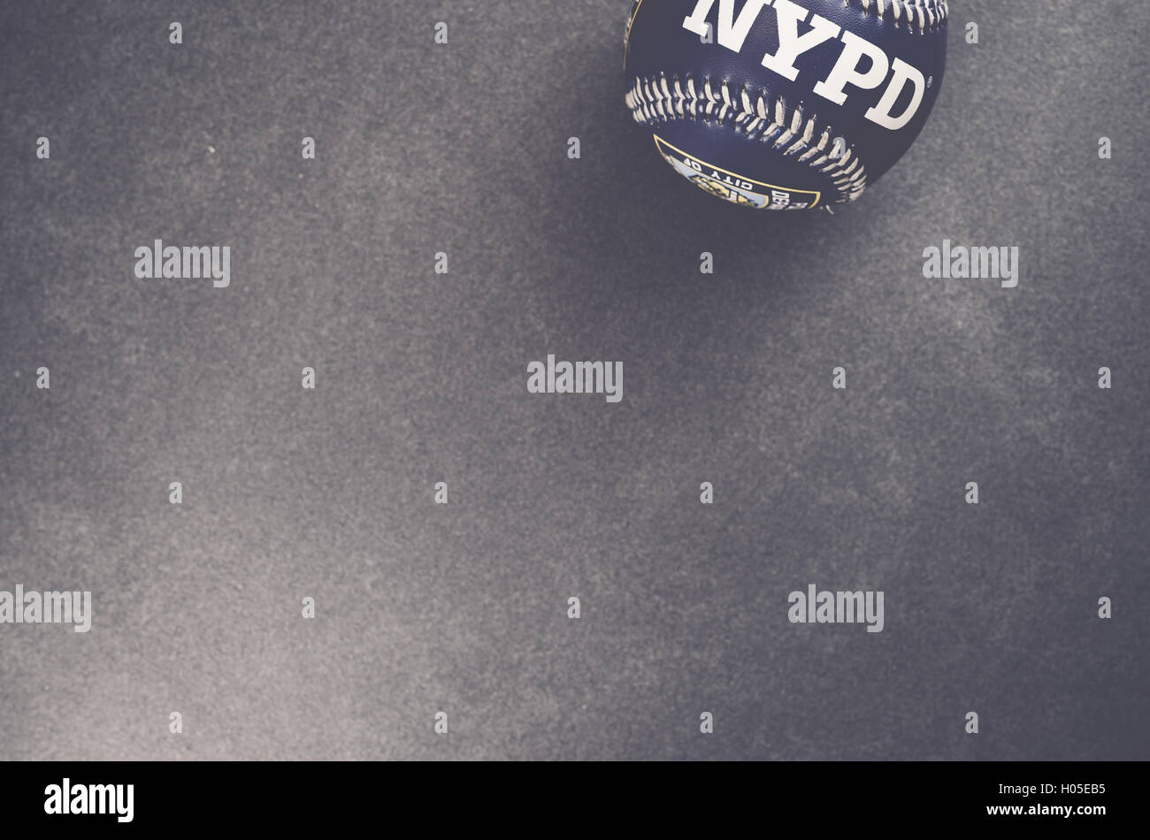 NYPD blue baseball ball on a stone background - copy space Stock Photo ...