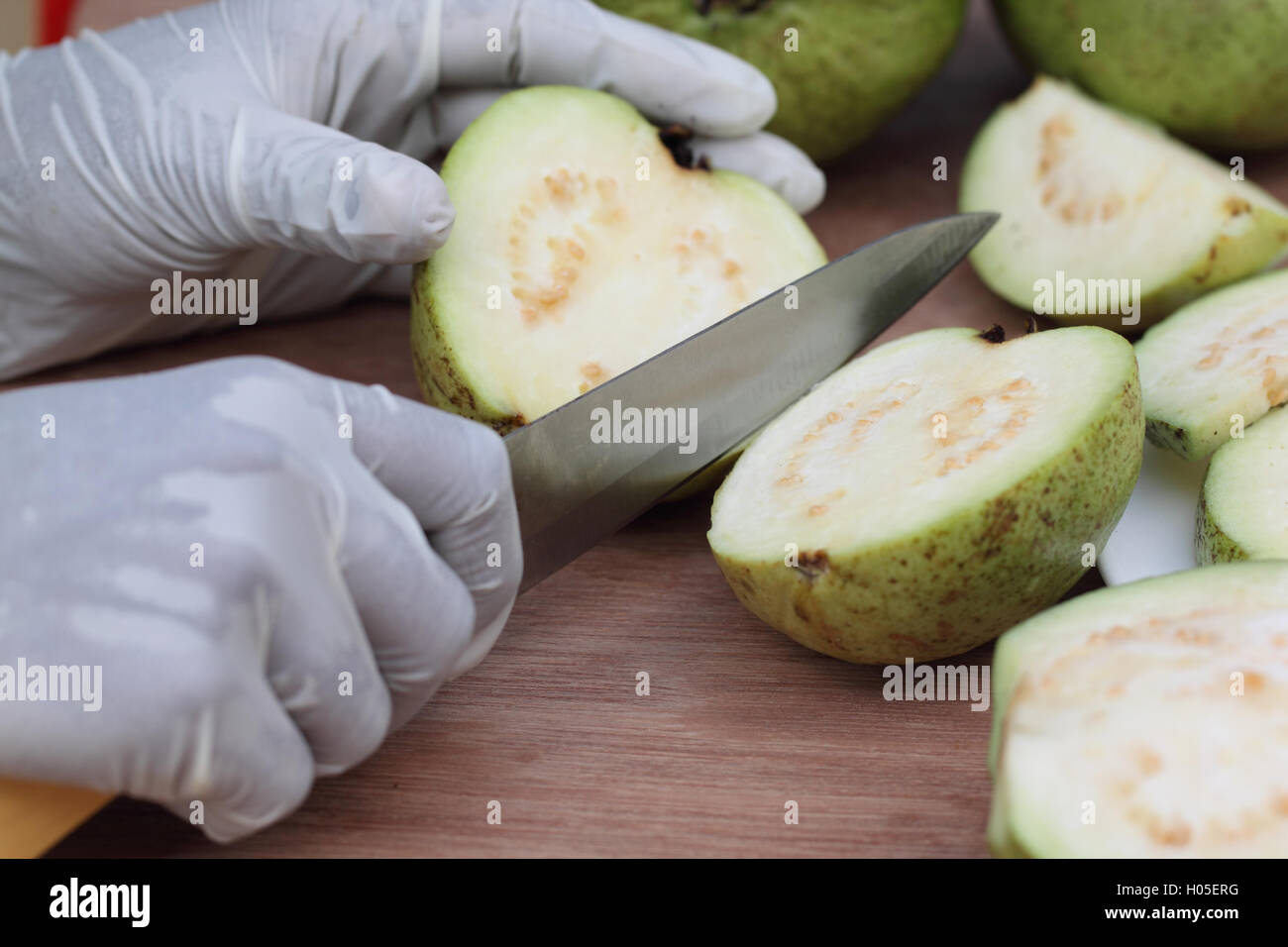 Cutting fresh guava Stock Photo - Alamy