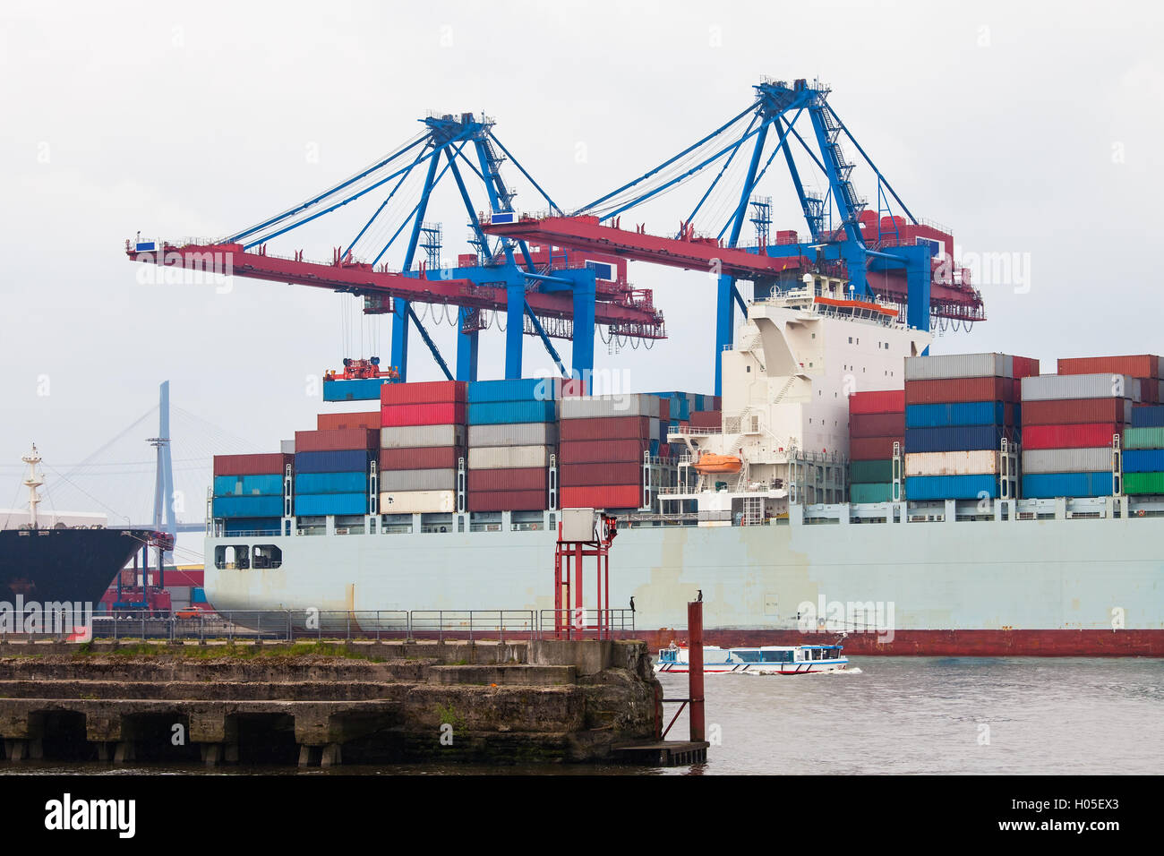 Container ship in port terminal Stock Photo - Alamy