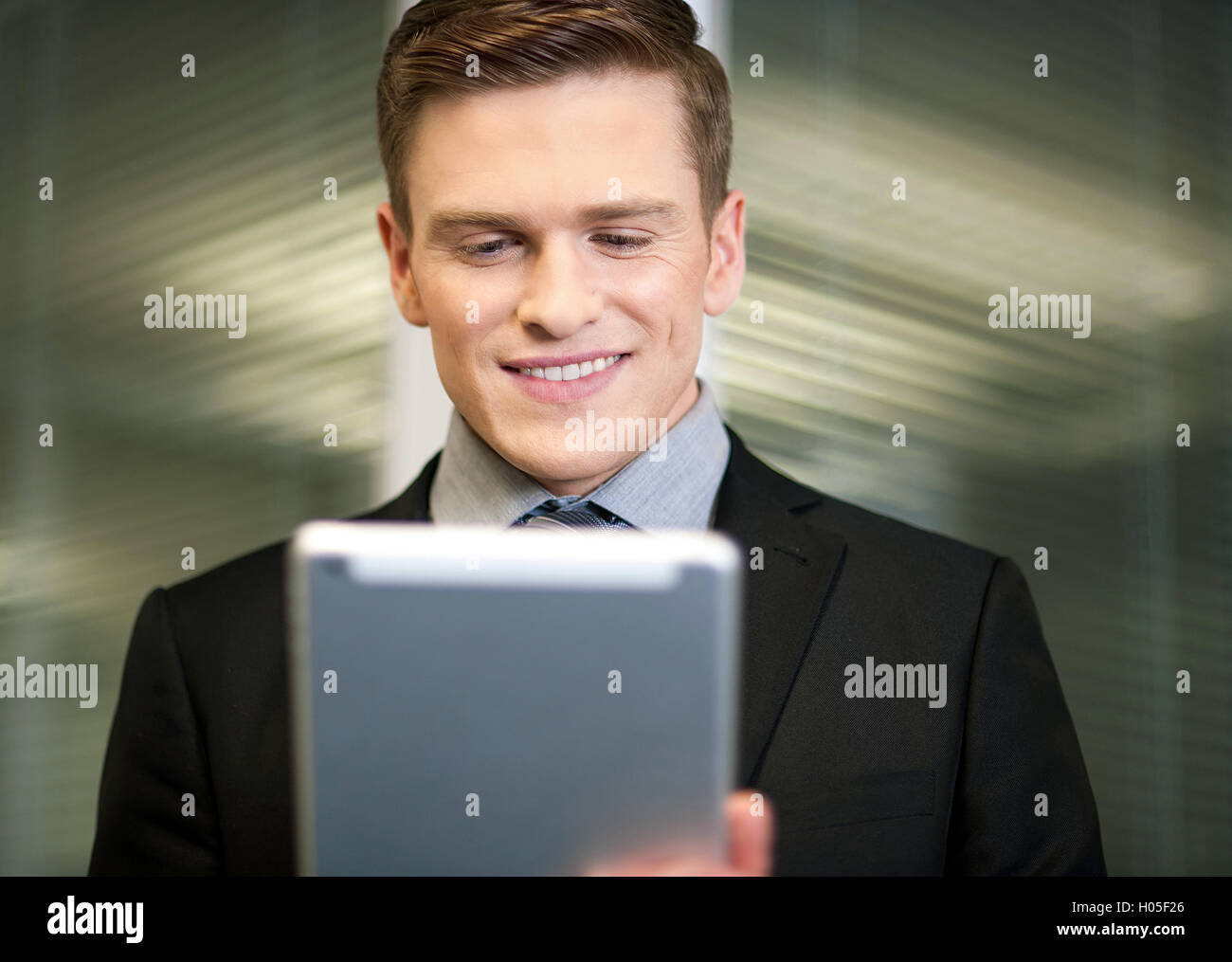 Experienced businessman using digital hi-res stock photography and ...