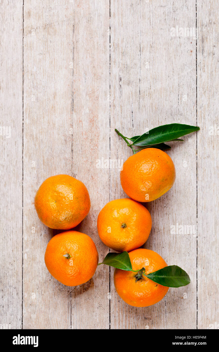 five tangerines with leaves Stock Photo - Alamy