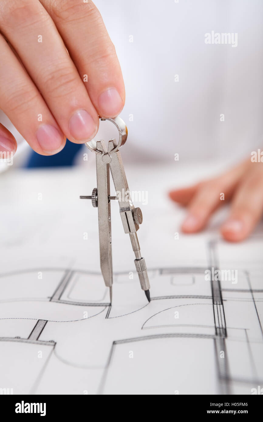Architect working on blueprints Stock Photo - Alamy