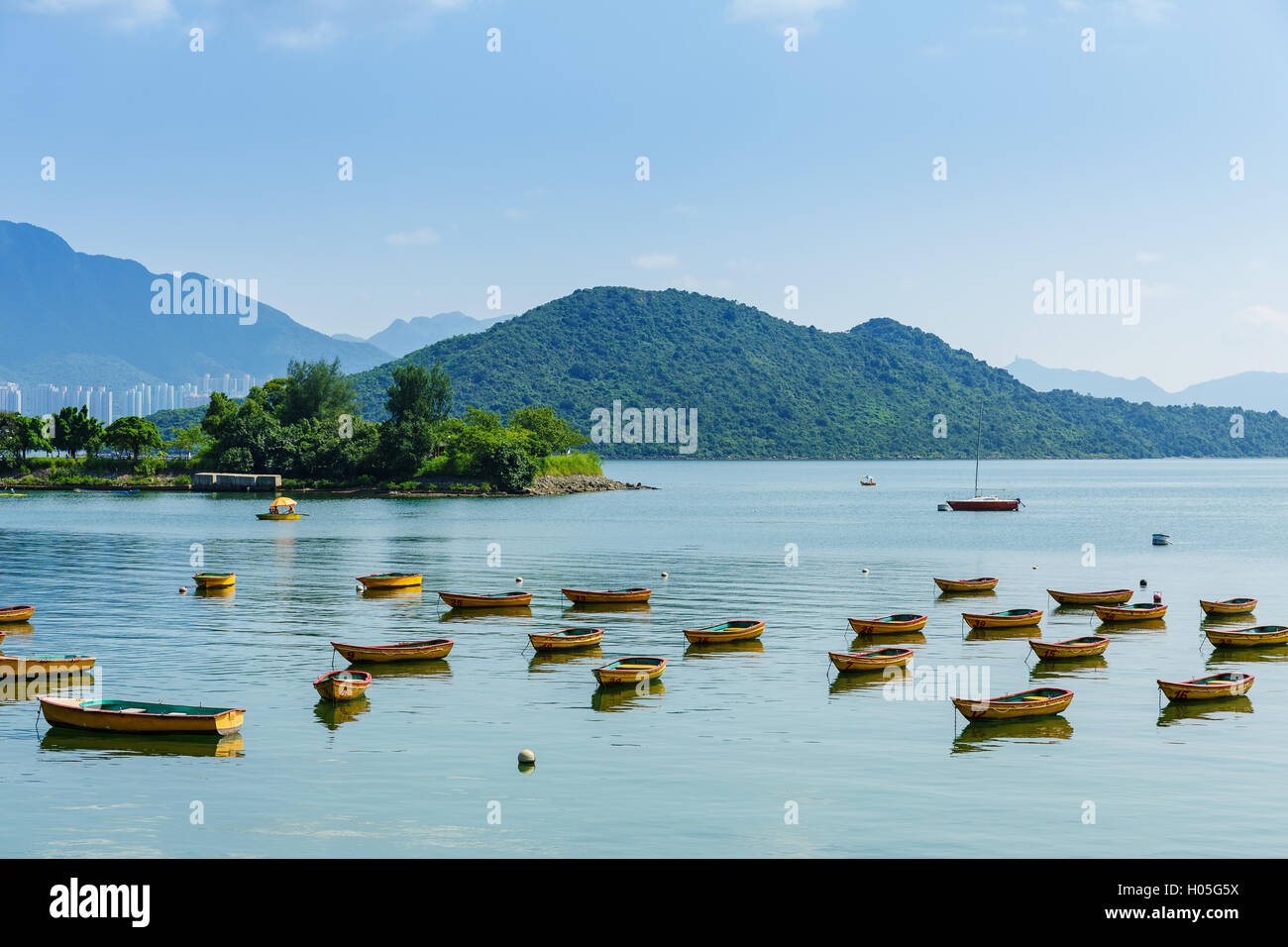 Beautiful coastline and boat Stock Photo - Alamy