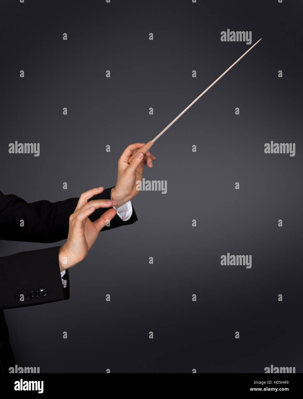 Music conductor with a baton Stock Photo - Alamy